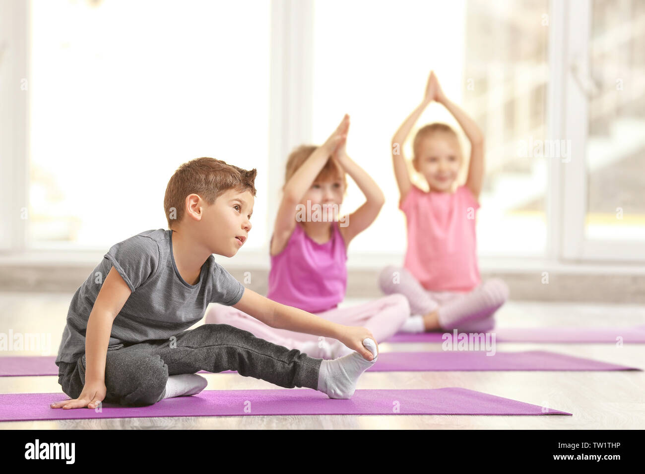 Group of children doing gymnastic exercises Stock Photo - Alamy