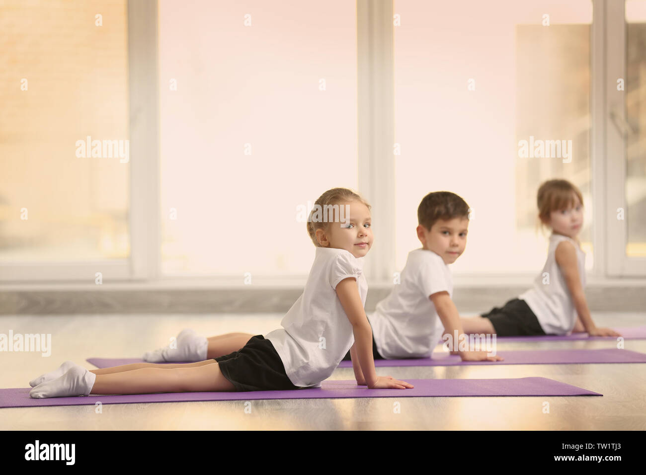 Group of children doing gymnastic exercises Stock Photo - Alamy