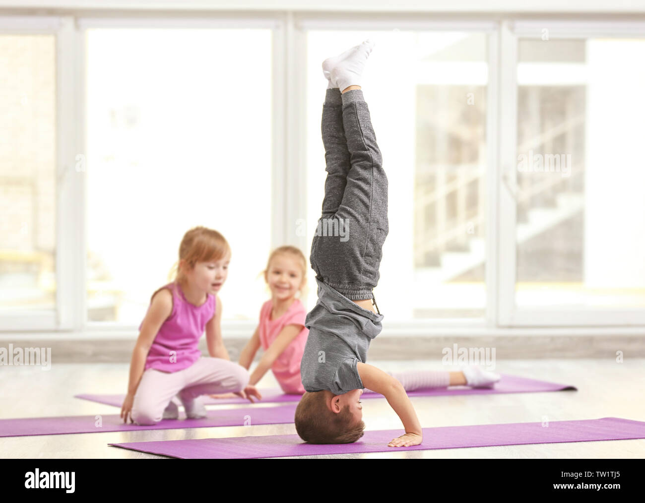 Group of children doing gymnastic exercises Stock Photo - Alamy