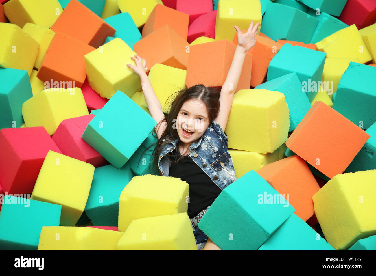 Cute girl playing with soft cubes Stock Photo - Alamy