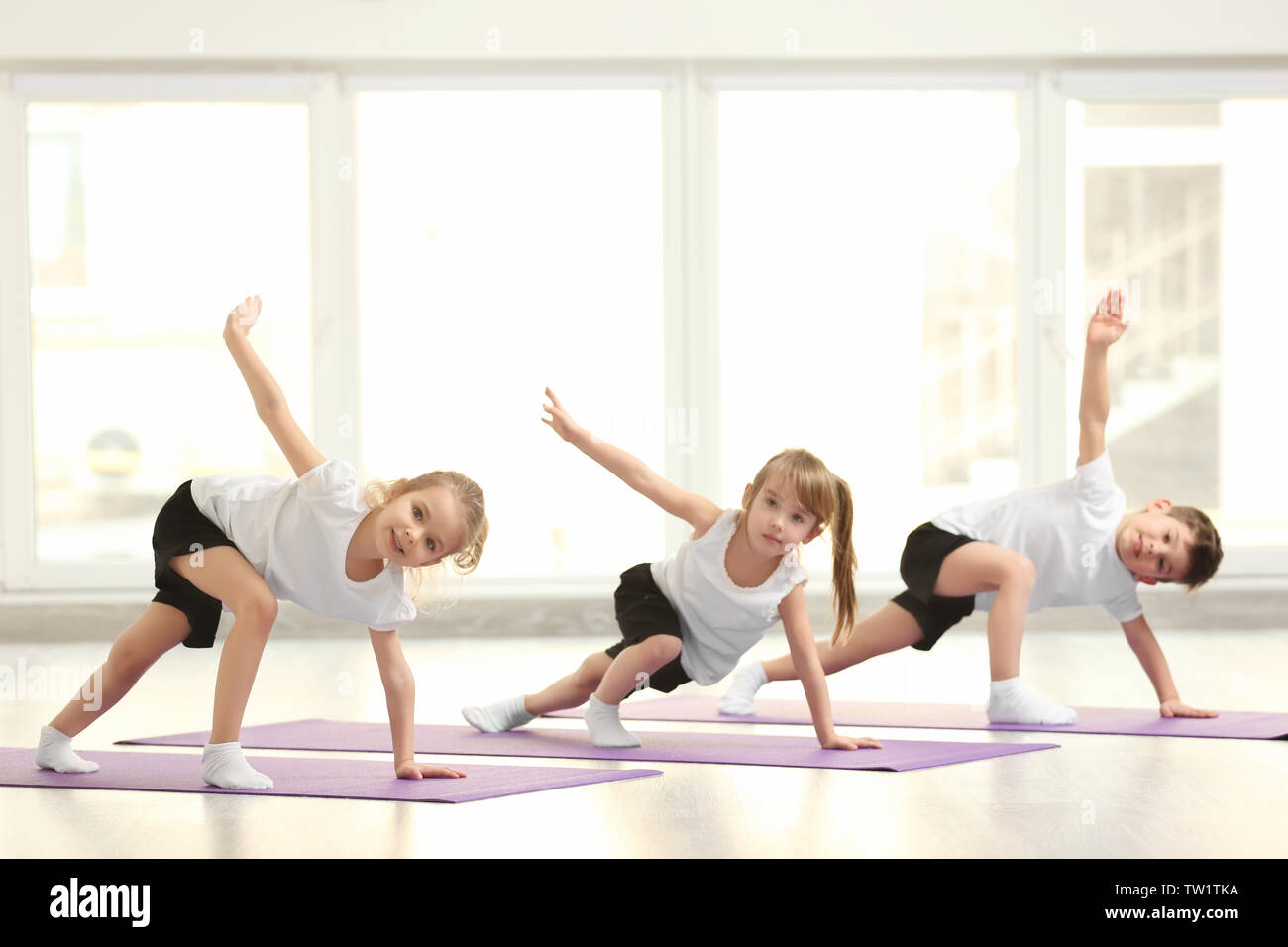 Group of children doing gymnastic exercises Stock Photo - Alamy