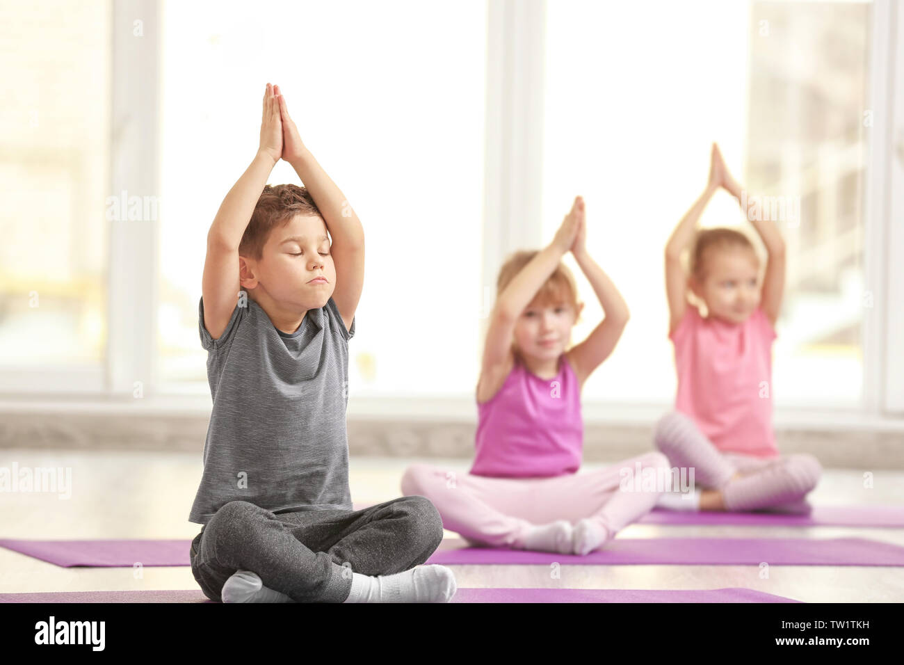 Group of children doing gymnastic exercises Stock Photo - Alamy