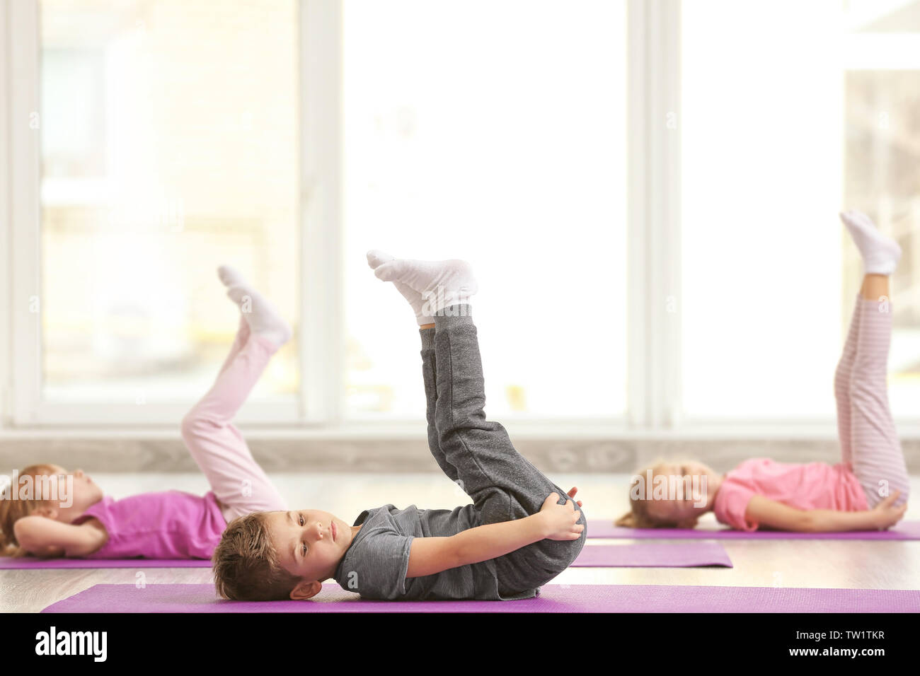 Group of children doing gymnastic exercises Stock Photo - Alamy