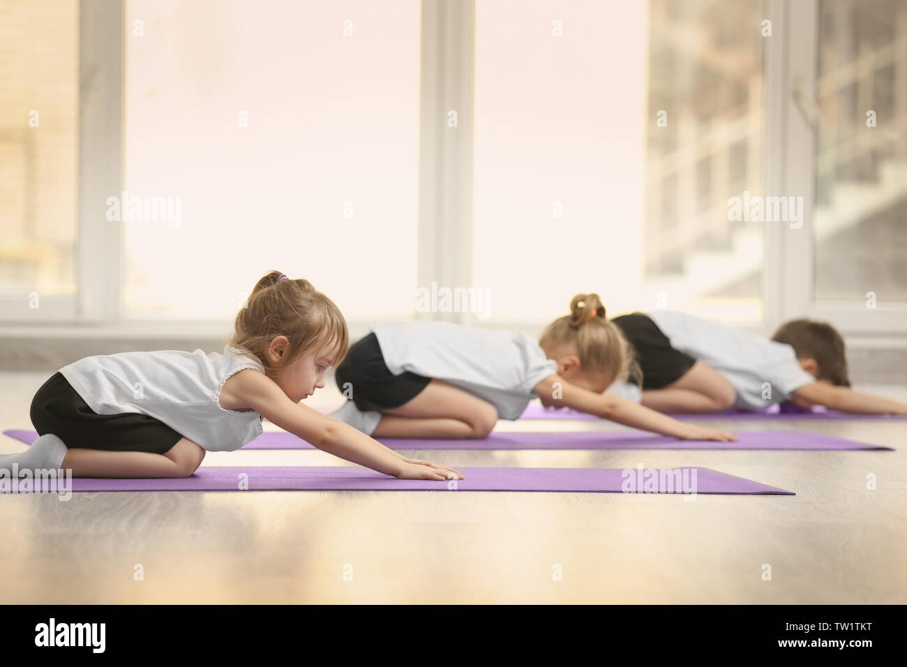 Group of children doing gymnastic exercises Stock Photo - Alamy