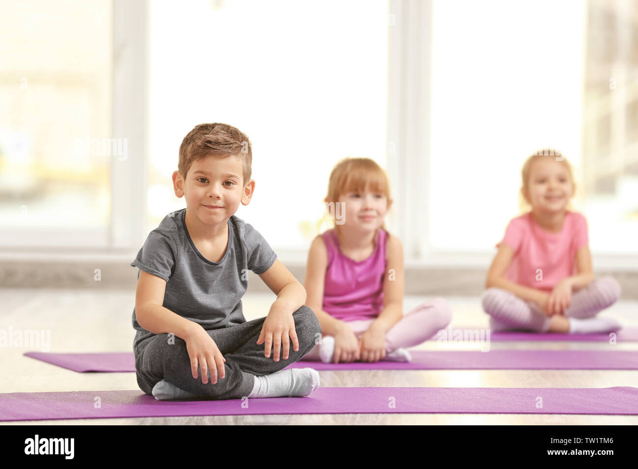 Group of children doing gymnastic exercises Stock Photo - Alamy