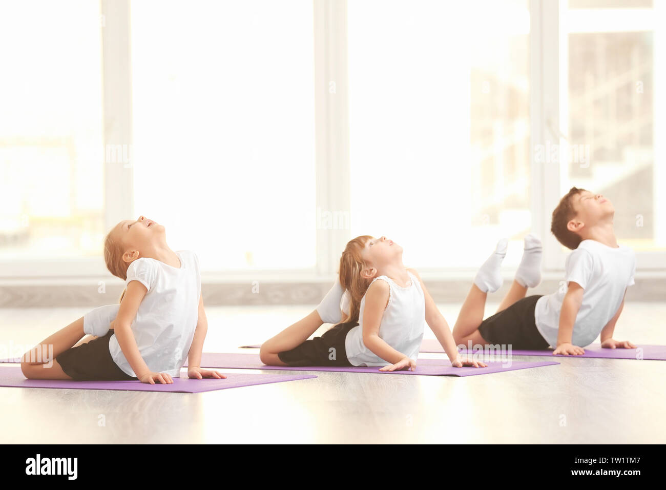 Group of children doing gymnastic exercises Stock Photo - Alamy