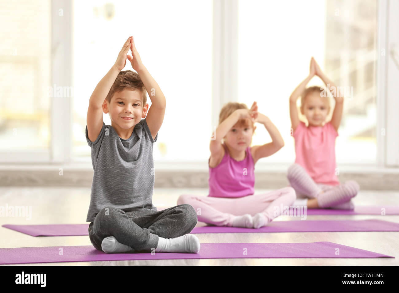 Group of children doing gymnastic exercises Stock Photo - Alamy