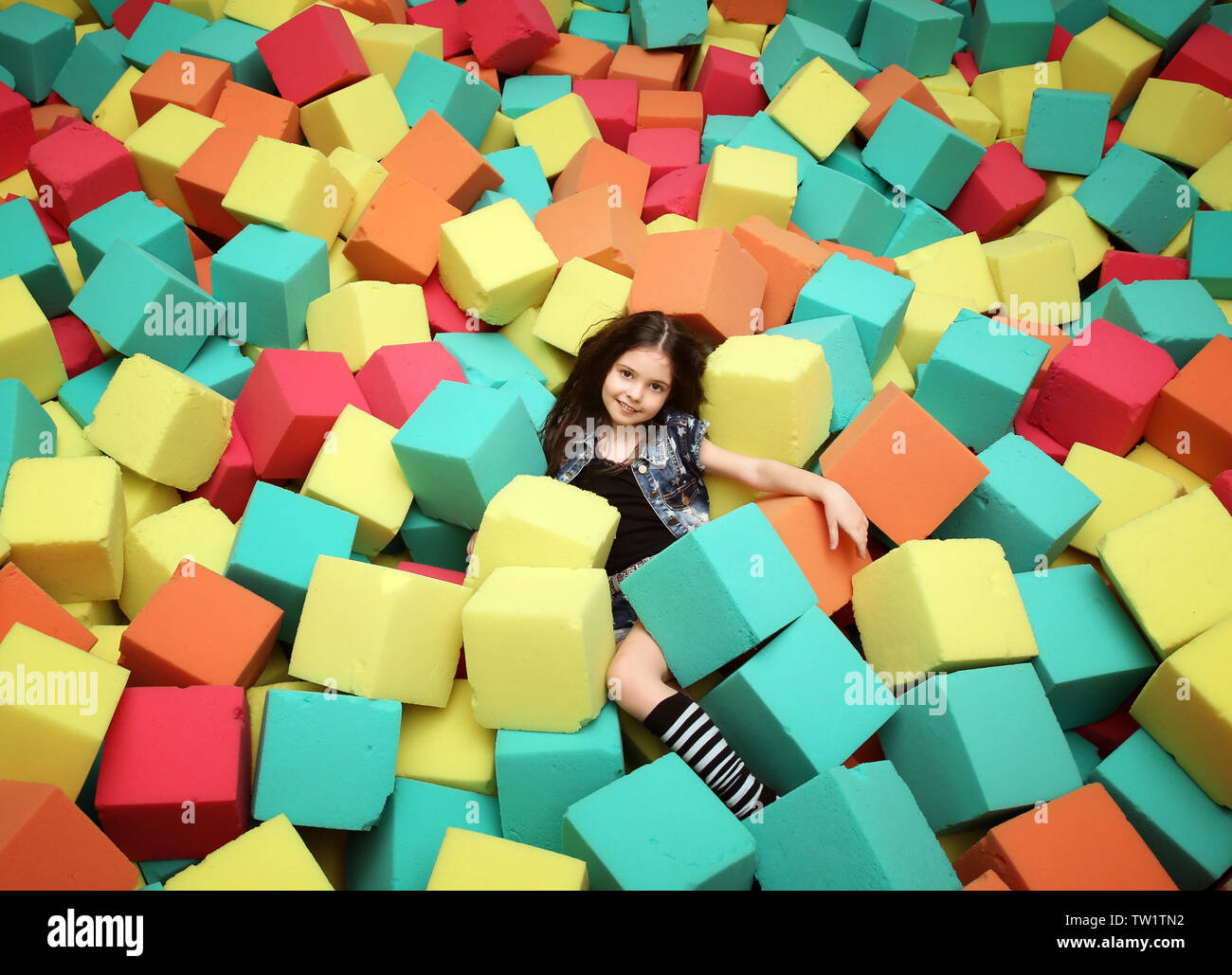 Cute girl playing with soft cubes Stock Photo - Alamy