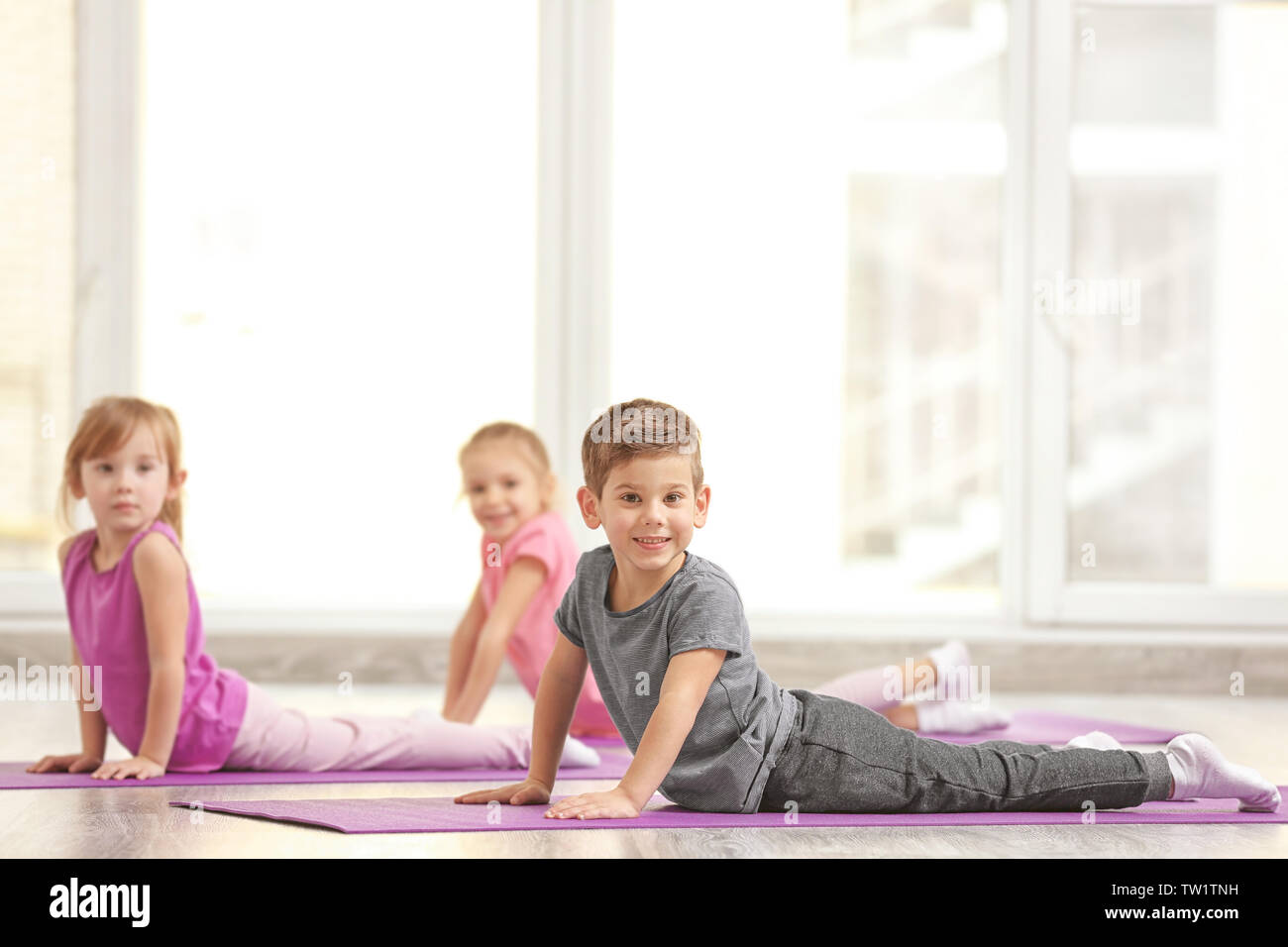Group of children doing gymnastic exercises Stock Photo - Alamy