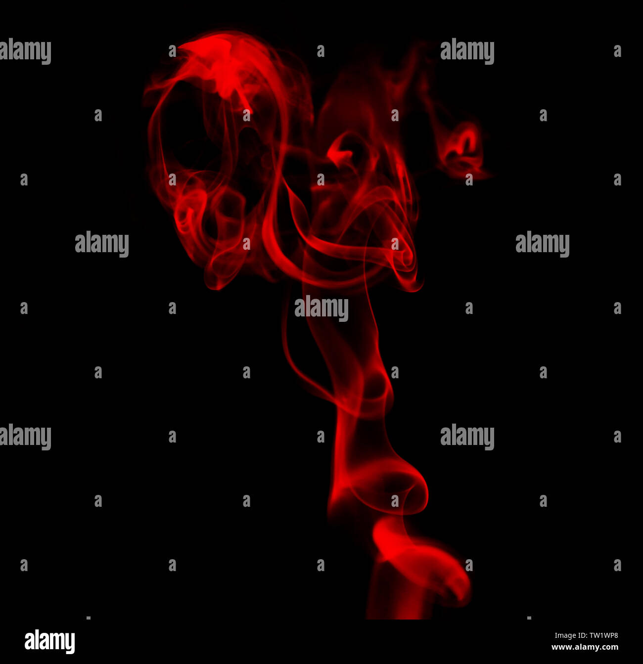 Swirl of red smoke on dark background Stock Photo - Alamy