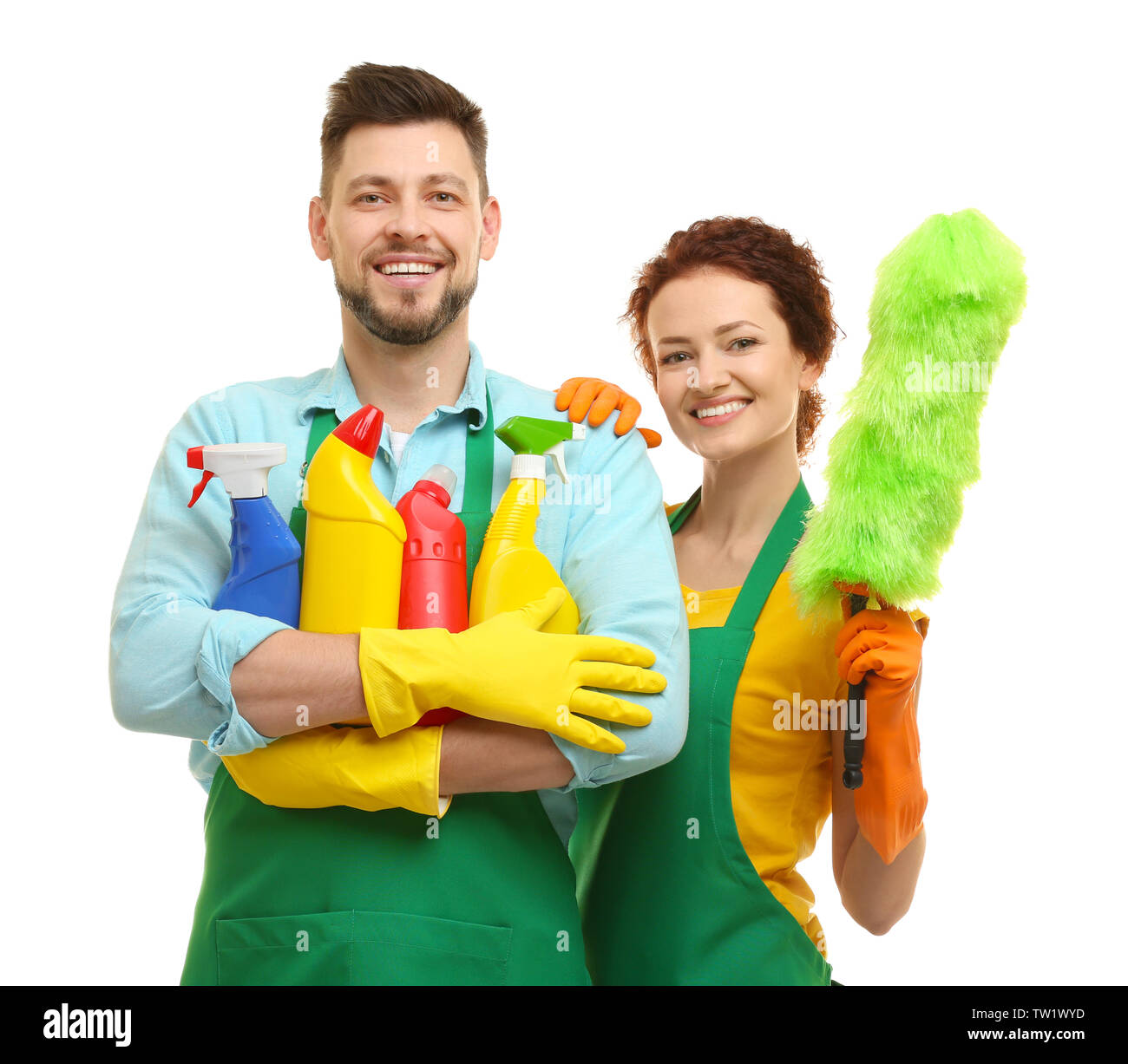 Couple with cleaning supplies on white background Stock Photo - Alamy