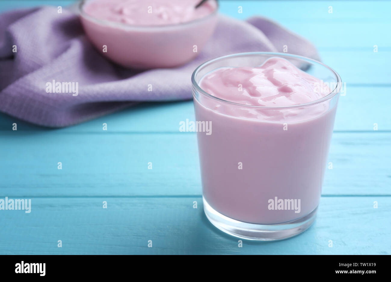 Tasty yogurt in glass on wooden table Stock Photo - Alamy