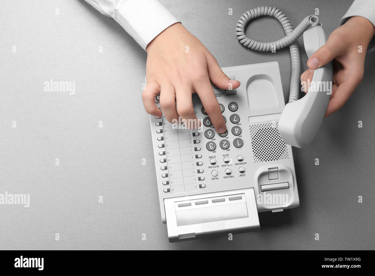 Young man dialing number talking hi-res stock photography and images ...