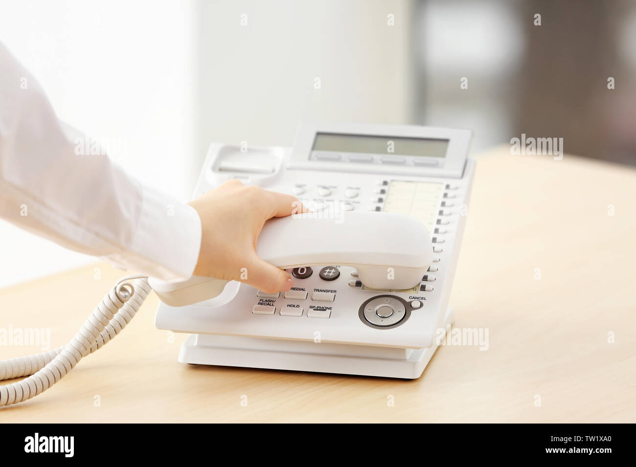 Holding telephone receiver in the hand hi-res stock photography and ...