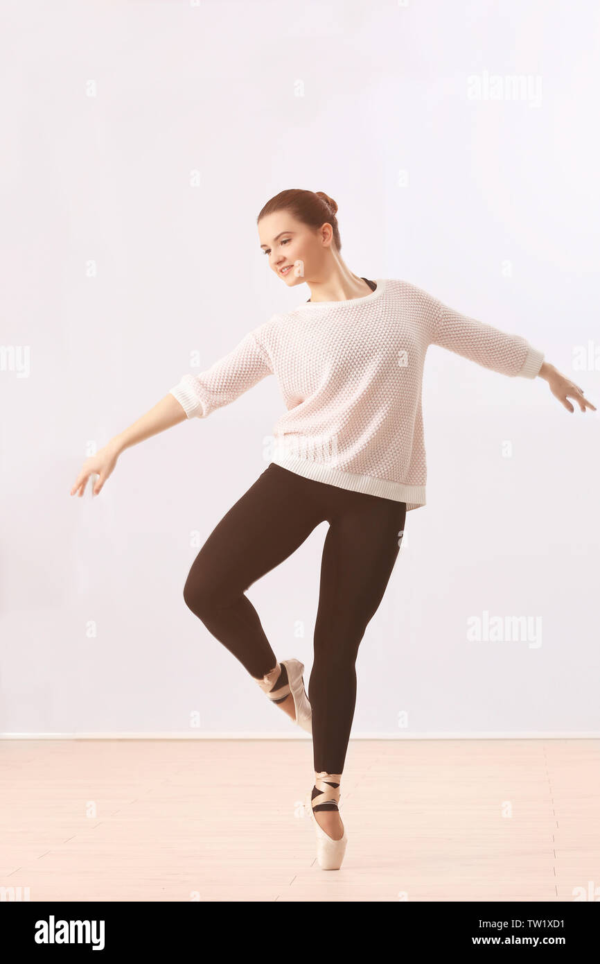 Ballet art concept. Young beautiful ballerina training in dance hall Stock Photo - Alamy