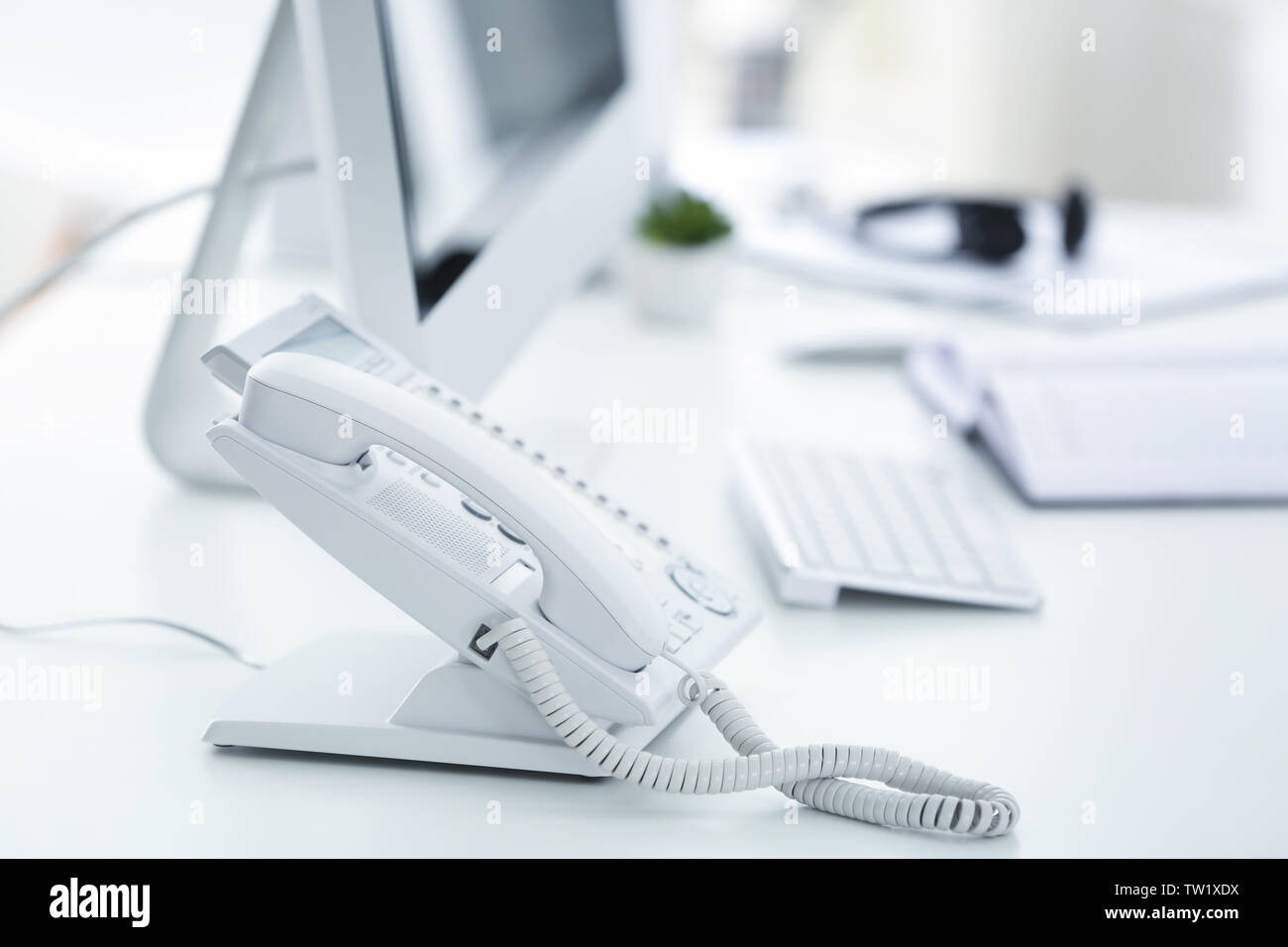 Telephone at workplace of technical support agent in office Stock Photo ...