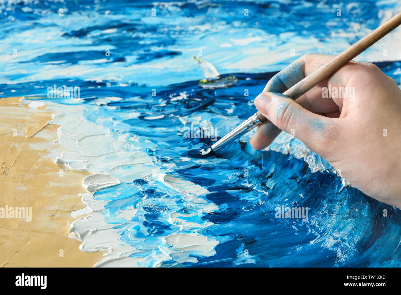 Female hand painting beautiful picture Stock Photo - Alamy