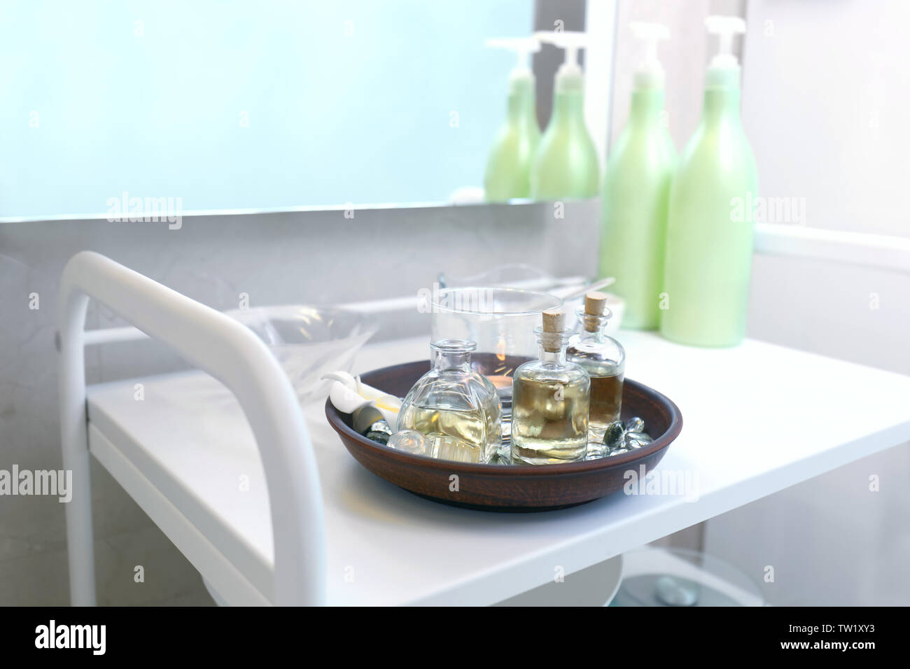 Set of essential oils in modern spa salon Stock Photo - Alamy