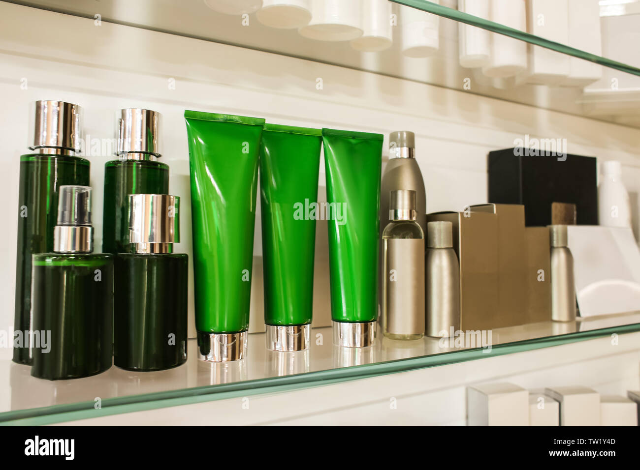 Different cosmetics in modern shop Stock Photo - Alamy