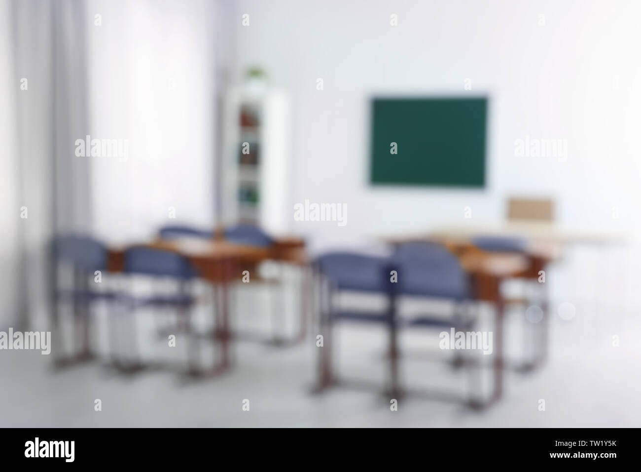 Blurred view of school classroom interior Stock Photo - Alamy