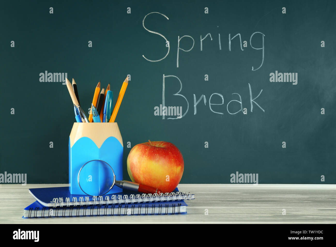 School stationery and "Spring break" text on chalkboard Stock Photo - Alamy