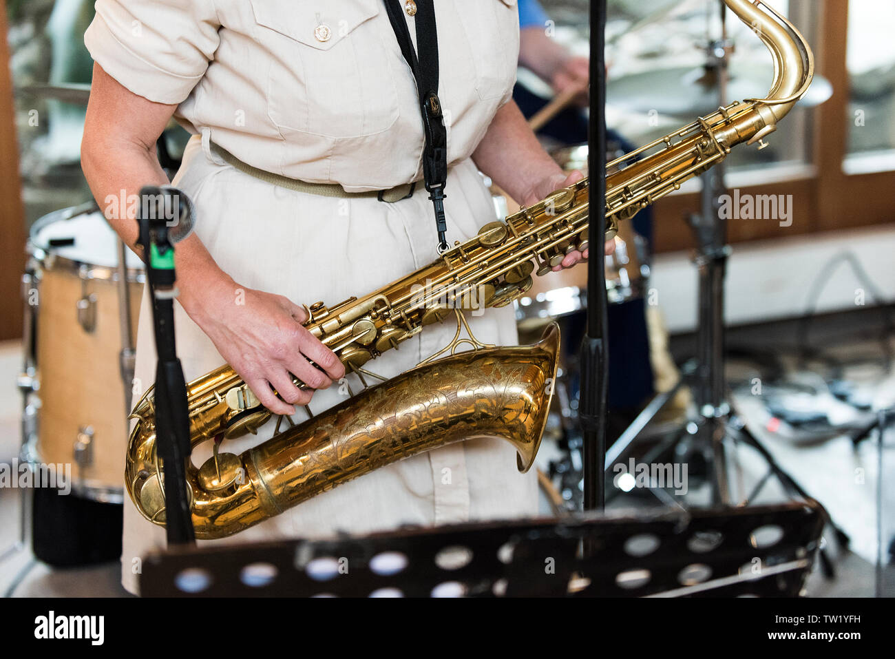 Holding music instrument hi-res stock photography and images - Alamy