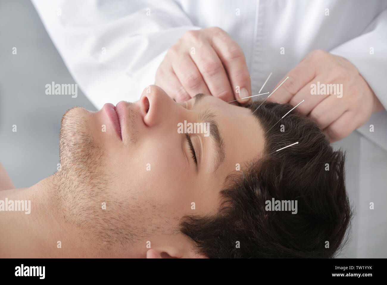 Male face with needles hi-res stock photography and images - Alamy