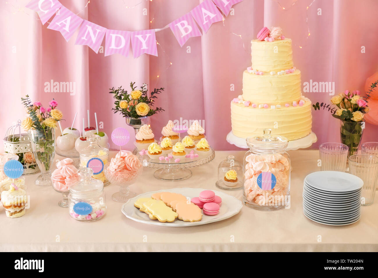 Candy bar. Table with different sweets for party Stock Photo - Alamy
