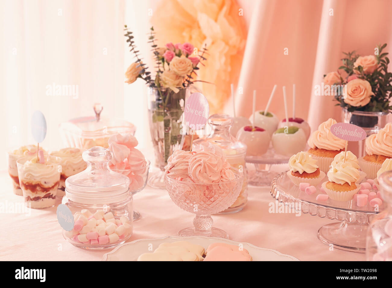 Candy bar. Table with different sweets for party Stock Photo - Alamy