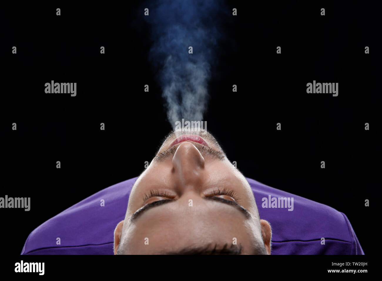 Exhaling smoke hi-res stock photography and images - Alamy