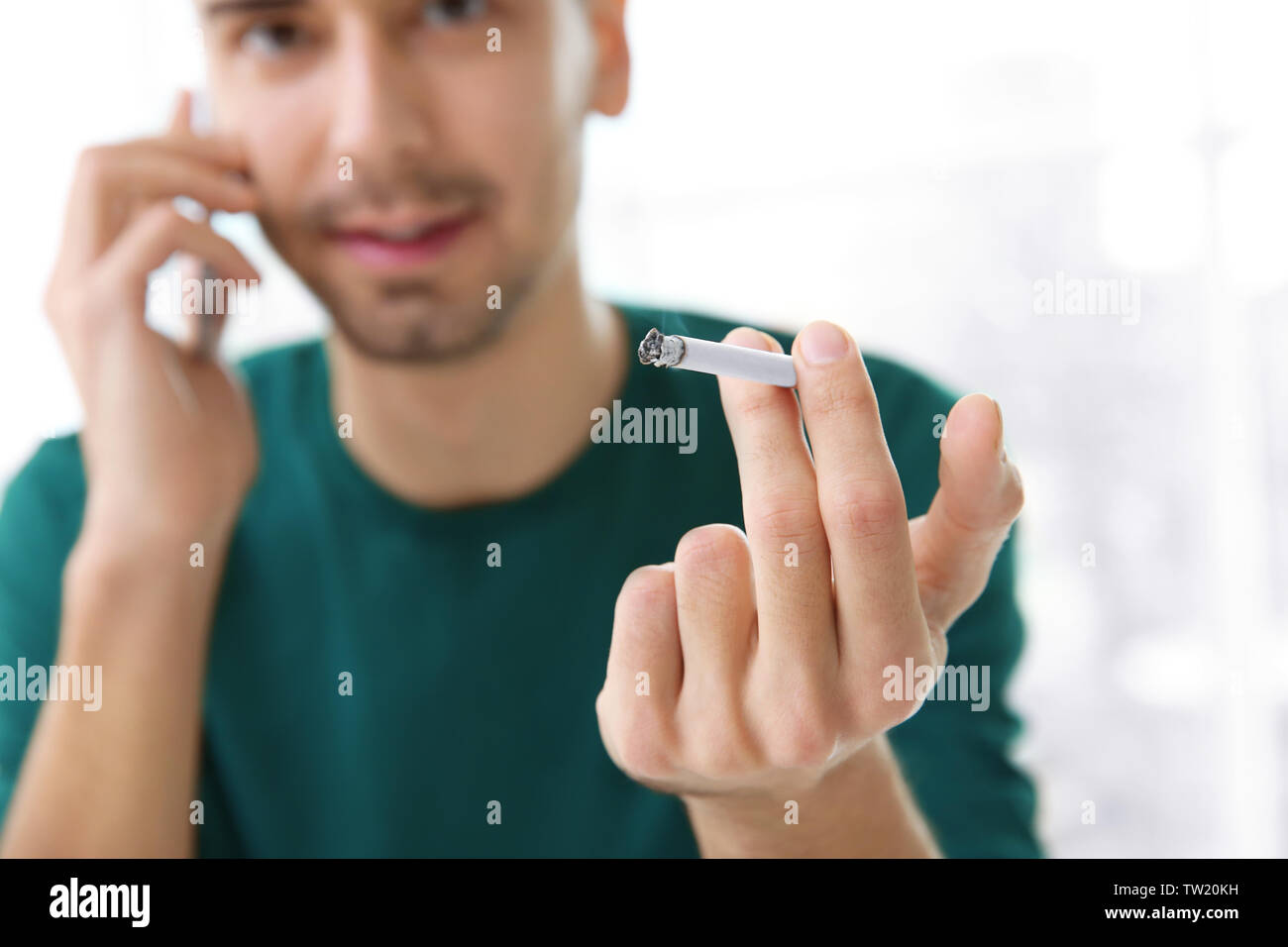 Smoker on the phone hi-res stock photography and images - Alamy