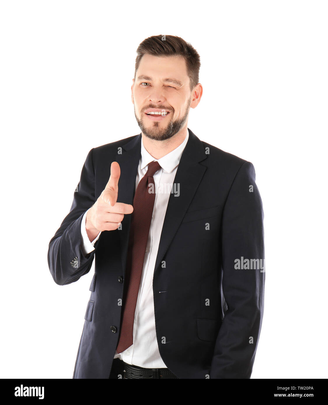 Handsome businessman in elegant suit winking and pointing on white ...