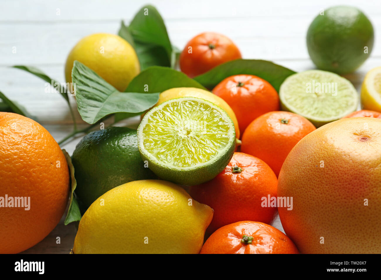 Beautiful composition of citrus fruits on wooden background Stock Photo ...