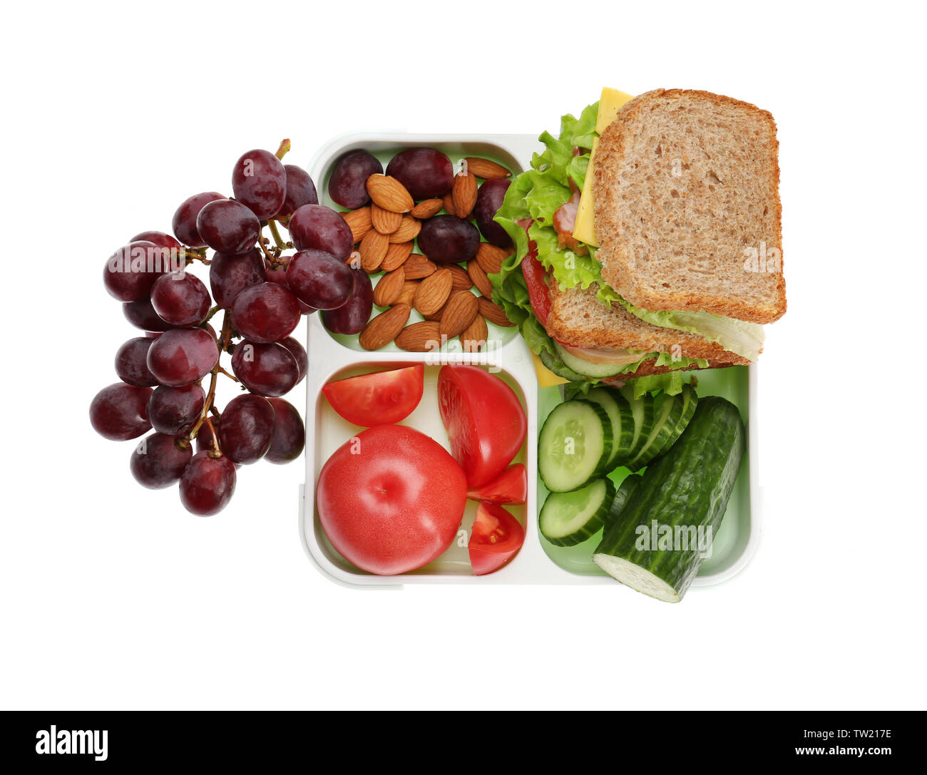 Lunch box with delicious food on white background Stock Photo - Alamy