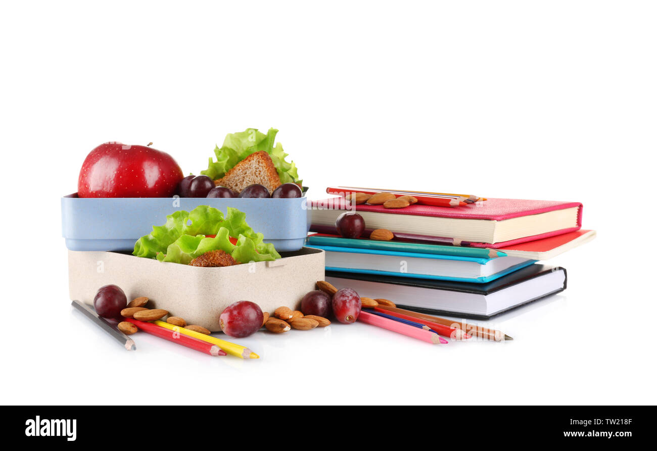 Lunch box with food and stationery on white background Stock Photo - Alamy