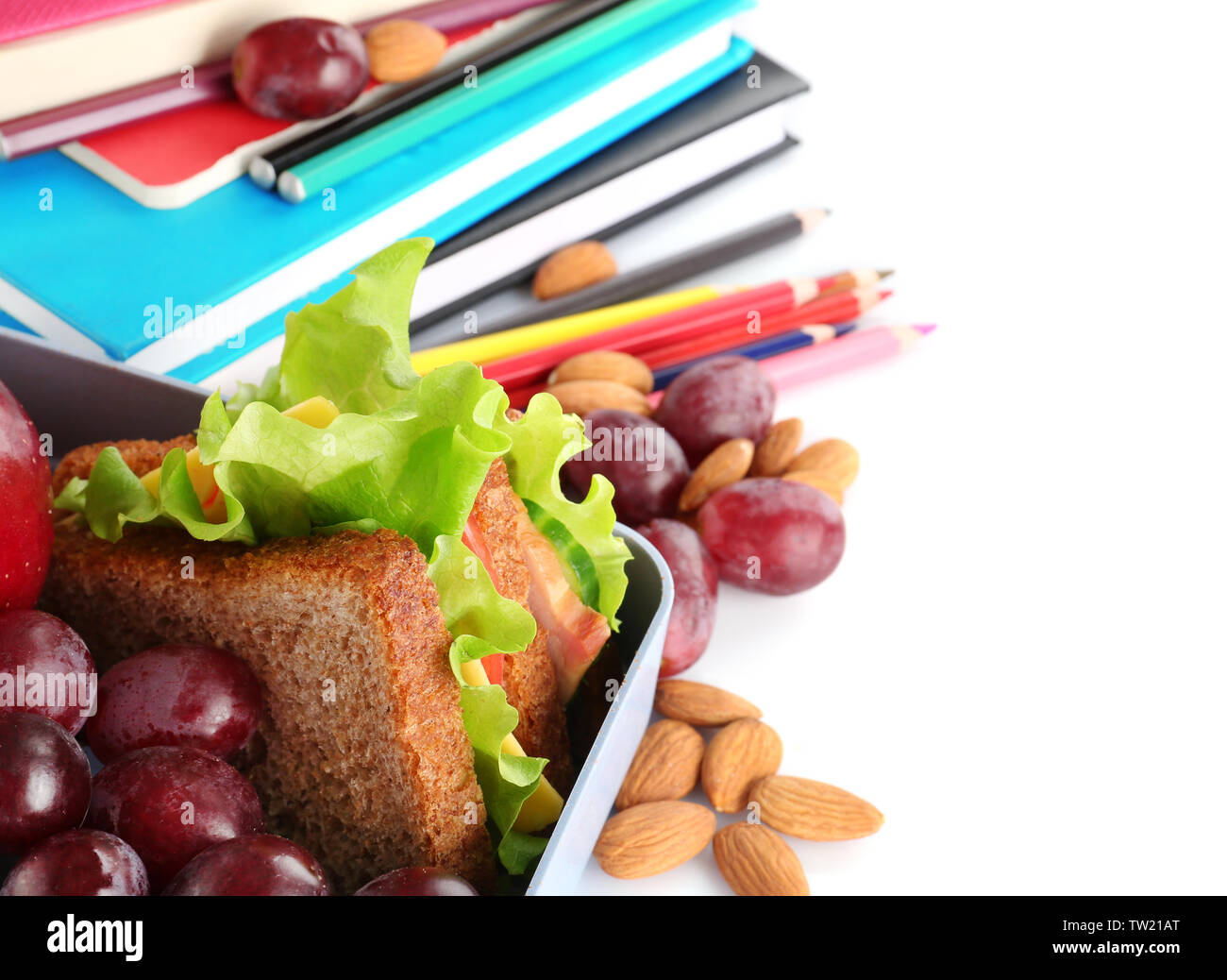 Lunch box with food and stationery on white background Stock Photo - Alamy