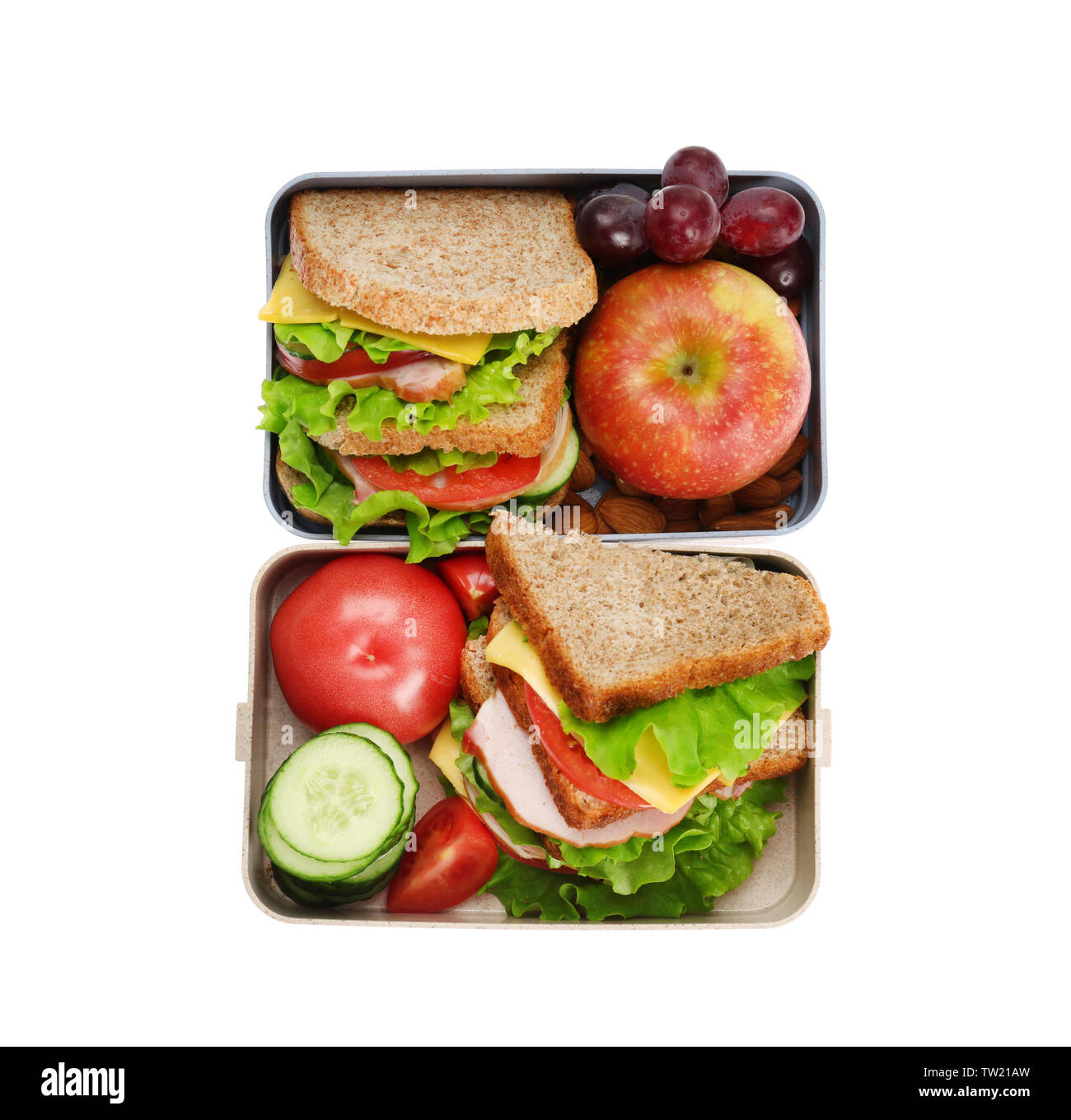 Lunch boxes with delicious food on white background Stock Photo - Alamy
