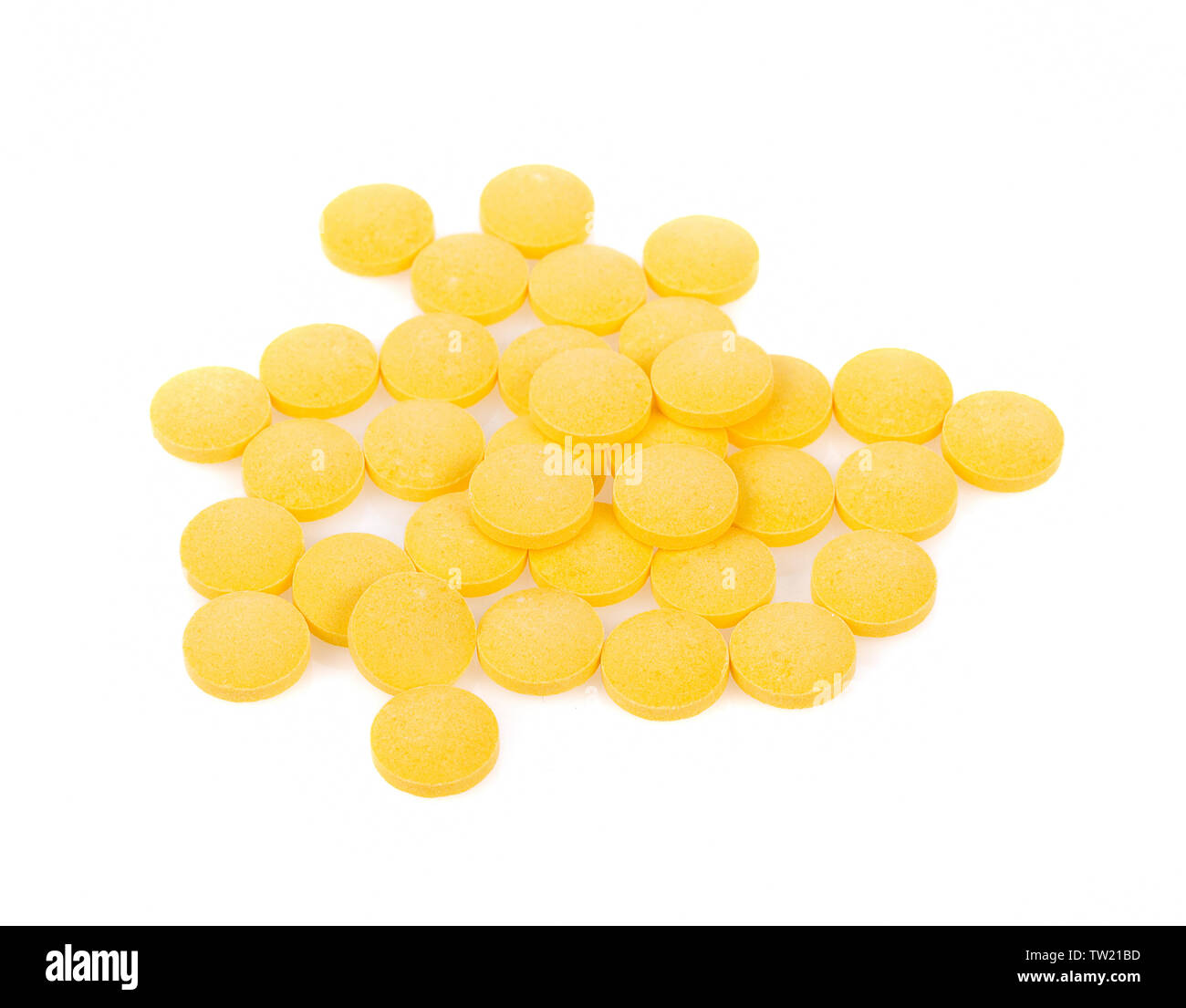 Yellow pills isolated on white background Stock Photo - Alamy
