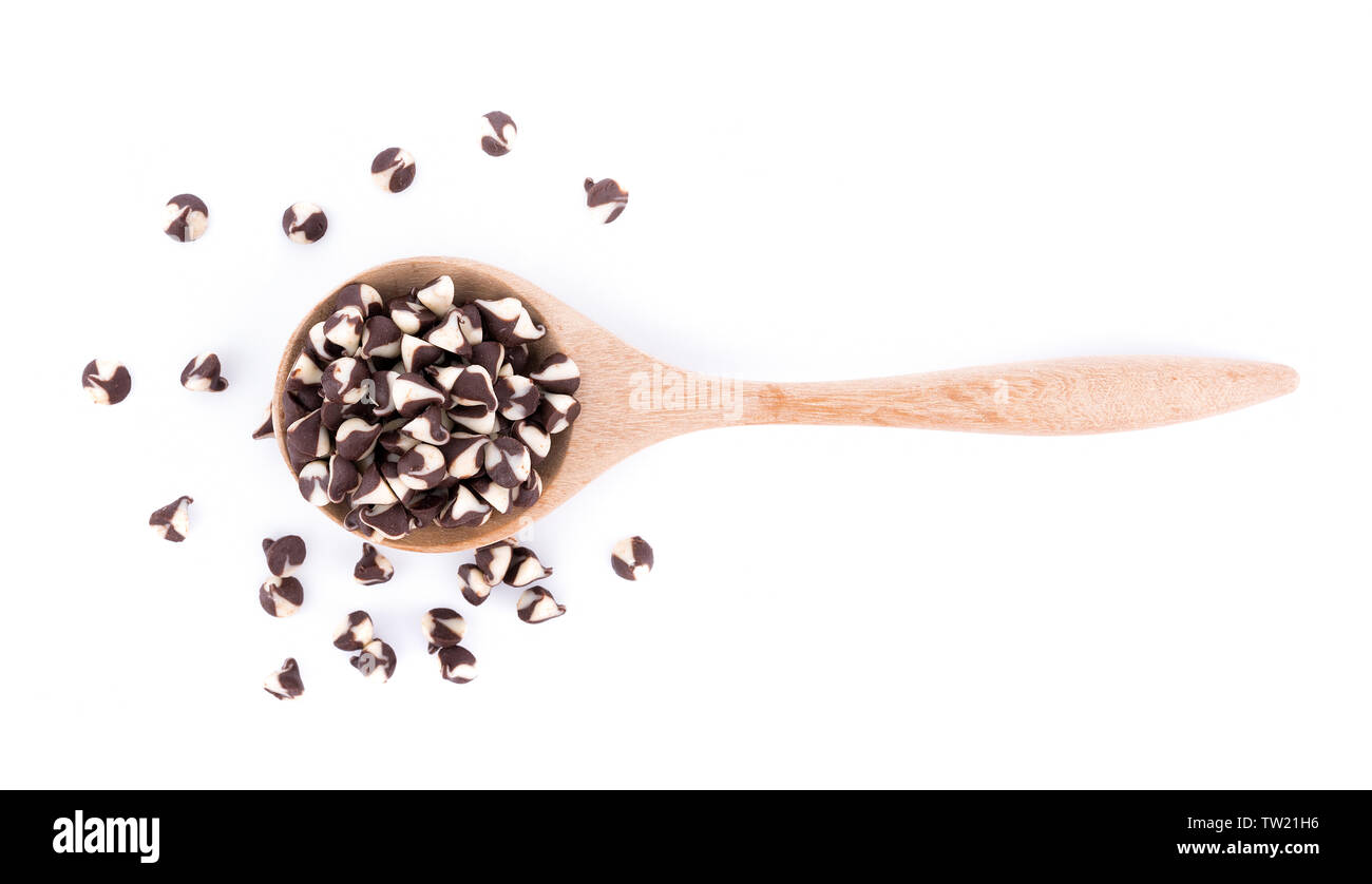Chocolate chip morsels spread in wooden spoon on white background Stock ...
