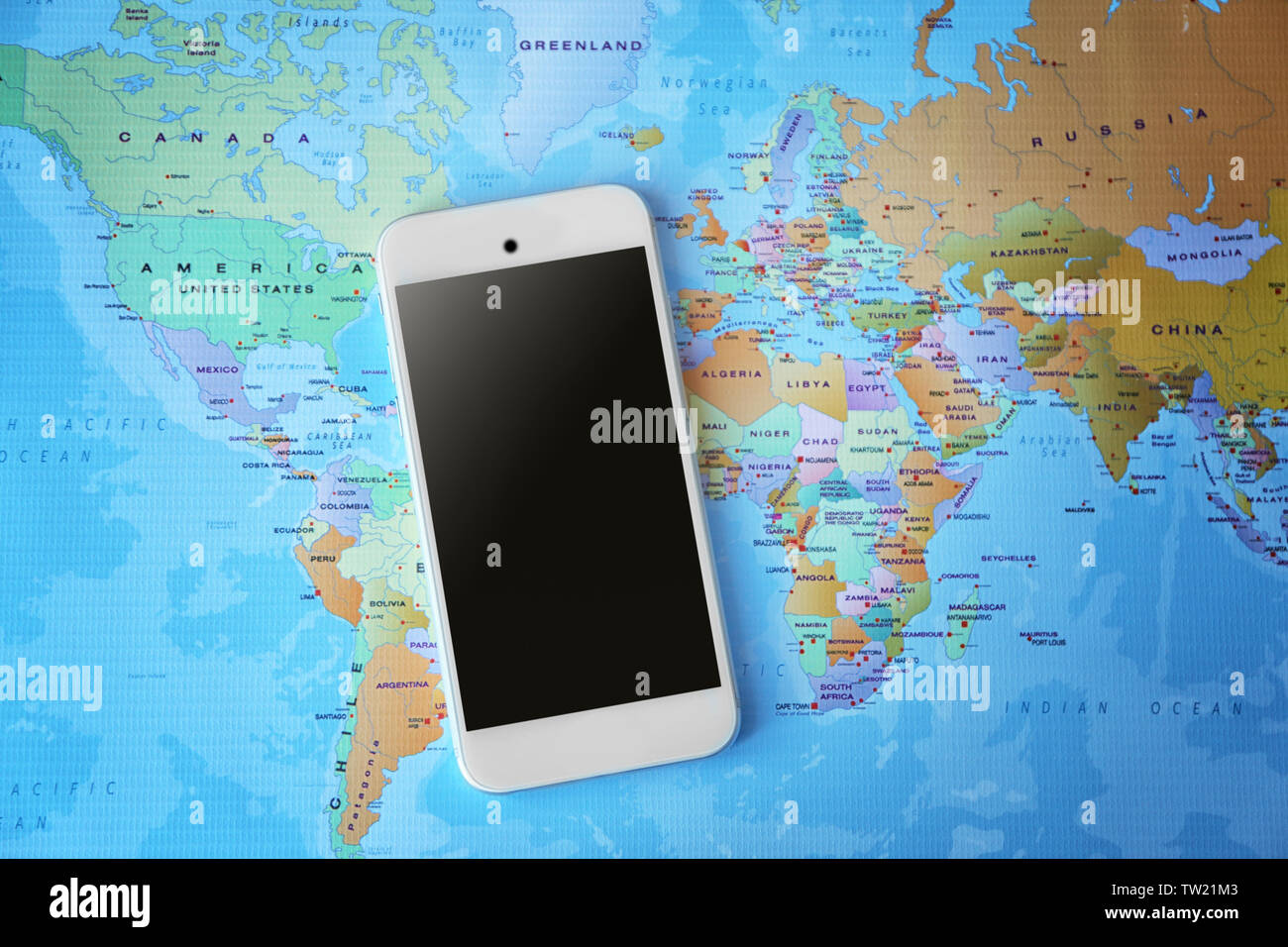Smartphone on world map background Stock Photo - Alamy