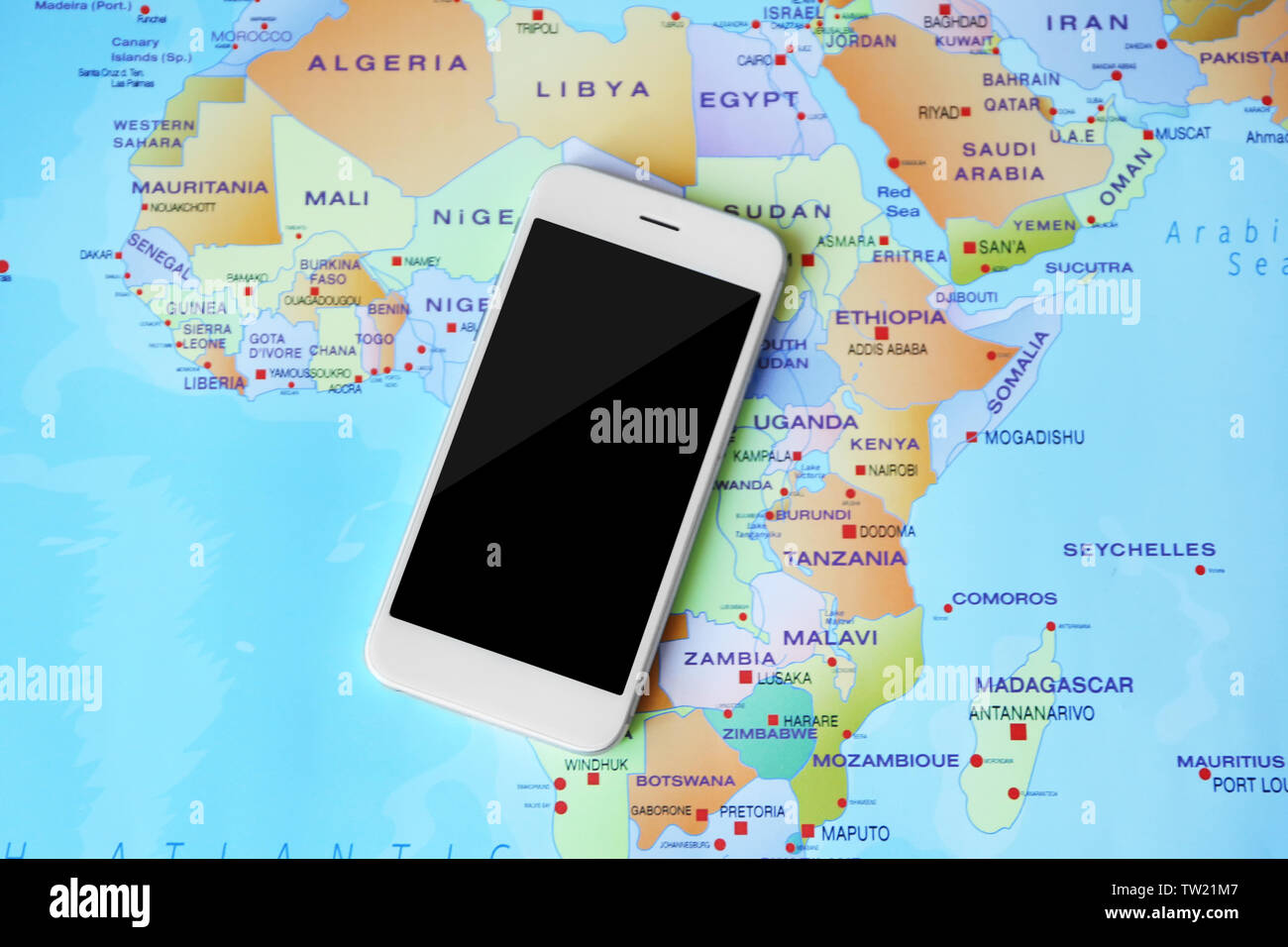 Smartphone on world map background Stock Photo - Alamy
