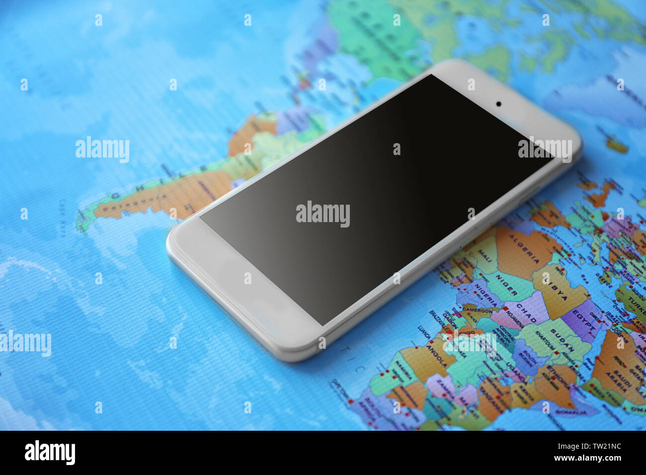 Smartphone on world map background Stock Photo - Alamy