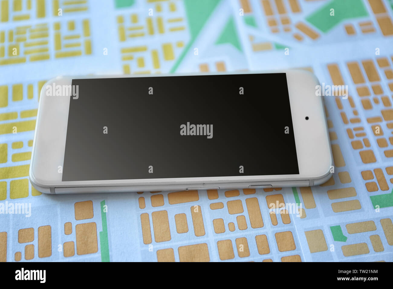 Smartphone on navigation map background Stock Photo - Alamy
