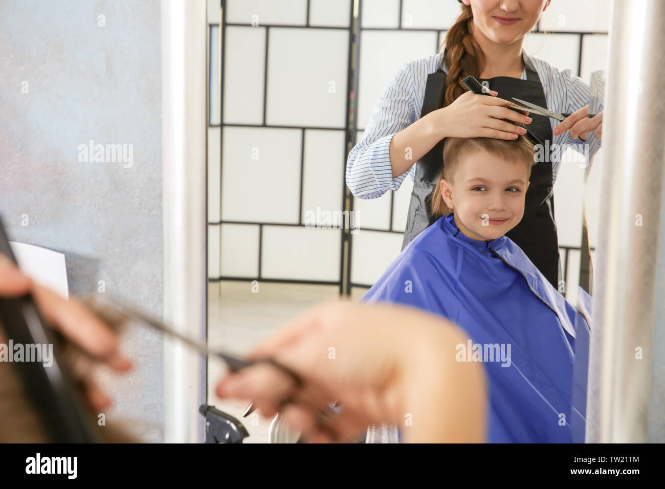 Cute little boy in hairdressing salon Stock Photo - Alamy