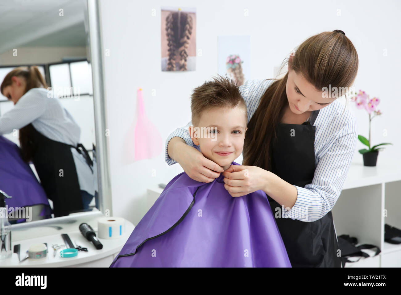 Cute little boy in hairdressing salon Stock Photo - Alamy