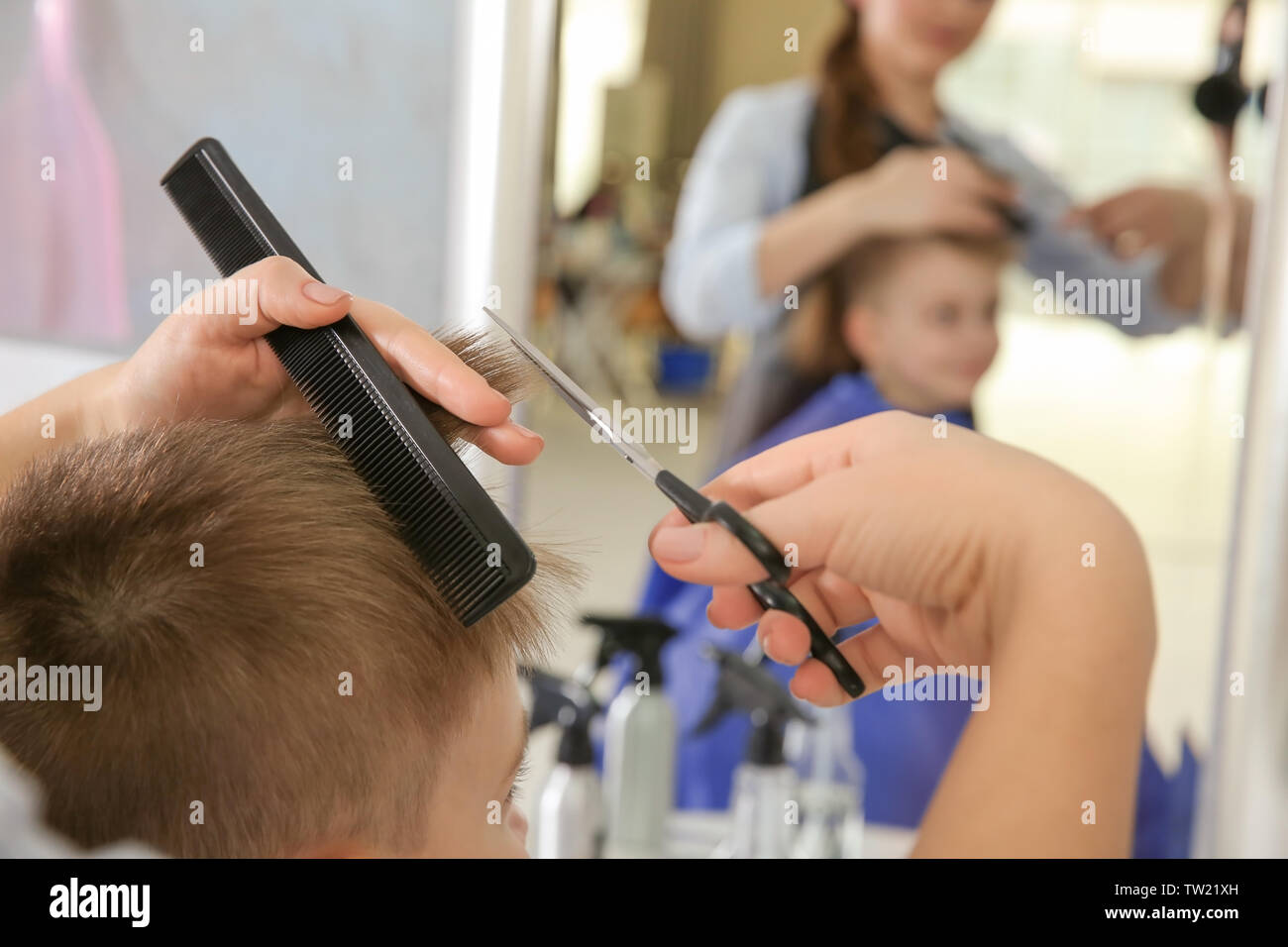 Cute little boy in hairdressing salon Stock Photo - Alamy