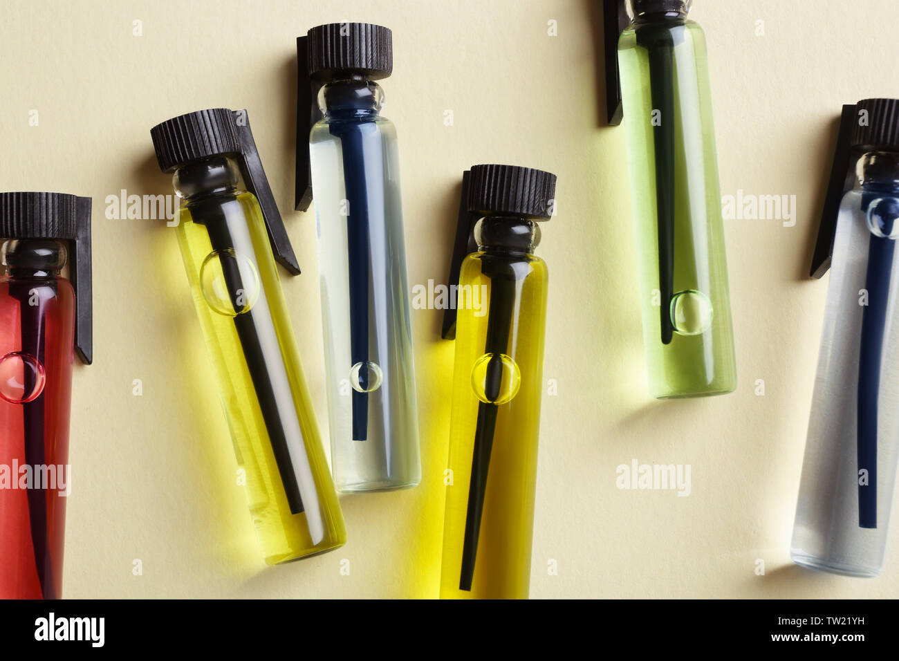 Perfume samples on light background Stock Photo - Alamy