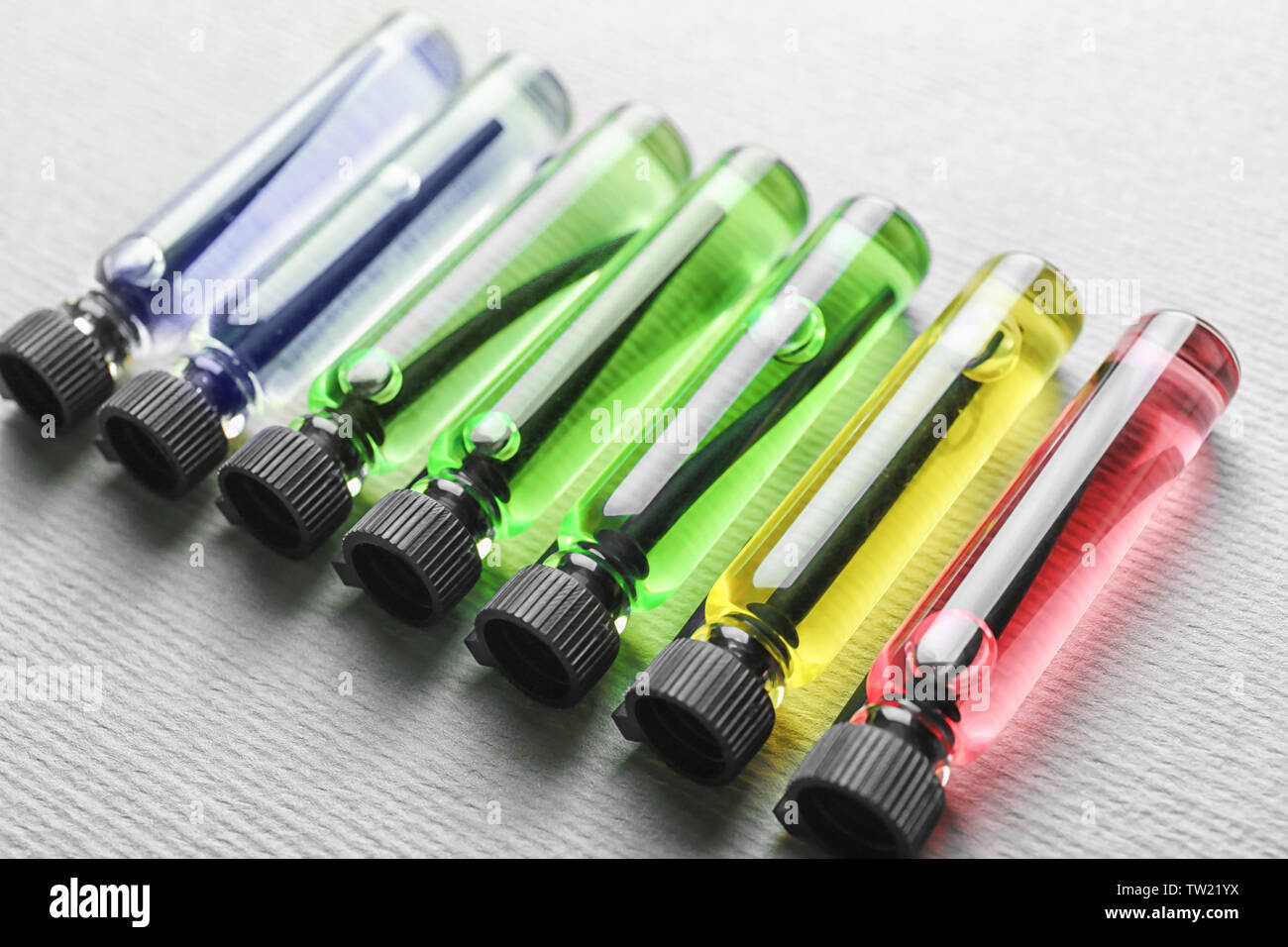 Perfume samples on light background Stock Photo - Alamy