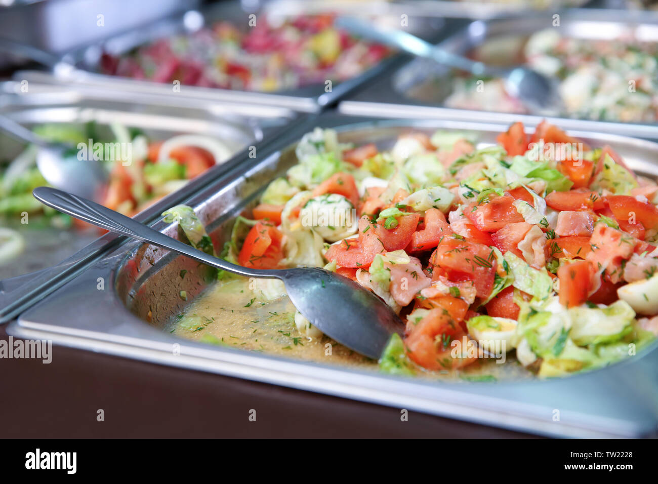 Steel self service trays filled with delicious food Stock Photo - Alamy