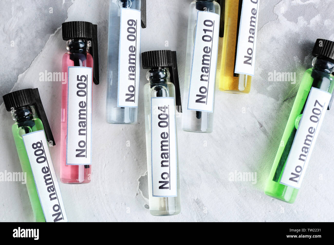 Perfume samples on light background Stock Photo - Alamy